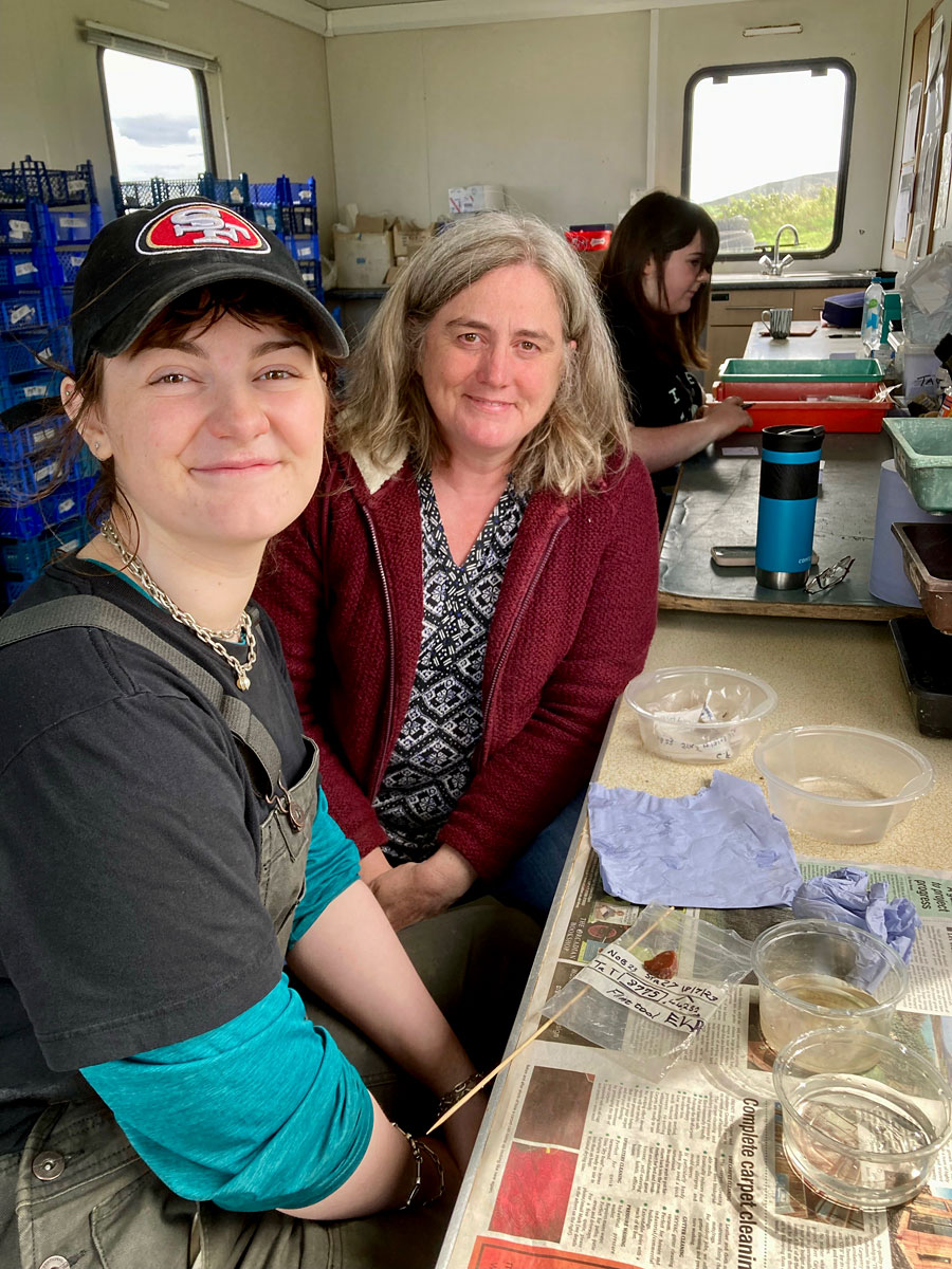 Estella with Rosalind in the finds hut cleaning the flint scraper she ...